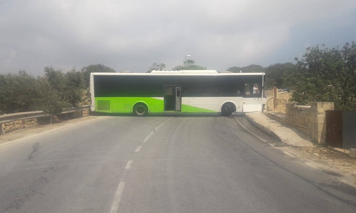 Loses control of bus and blocks road during accident - rubble wall ...